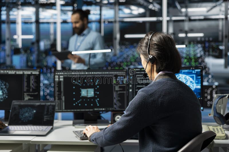 Admin in Data Center Speaks in Headset Mic, Troubleshooting Issues ...