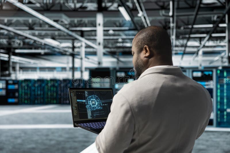 Admin Using Laptop in Data Center Used for Storing AI Training Datasets ...