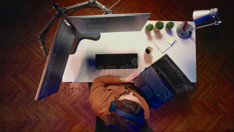 It Admin Using Multimonitor PC Setup and Laptop To Finish Tasks, Aerial ...