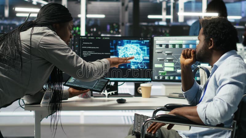 Admin in Wheelchair and Data Center Coworker Work Together Using Node Tree Tool Stock Footage ...