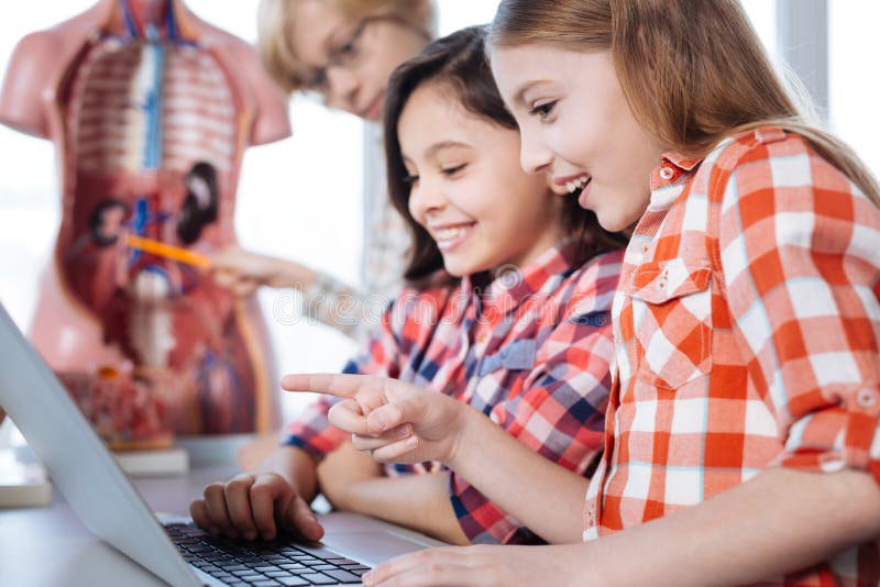 Admirable Enthusiastic Girls Comparing Pictures and Models Stock Photo ...