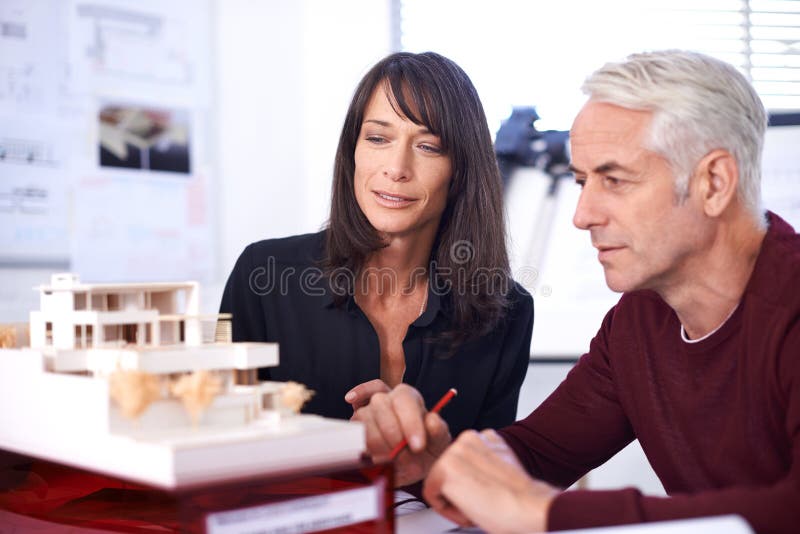 Admiring Their Work. Two Architects in Working on a Model of a House ...