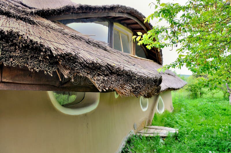 Adobe Clay House with Thatch Stock Photo - Image of meadow, green: 14436972