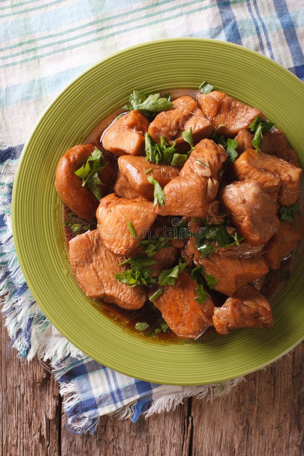 Adobo Chicken with Herbs Close-up on a Plate. Vertical Top View Stock ...