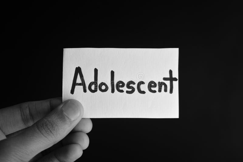 ADOLESCENT stock photo. Image of holding, reading, paper - 373569726