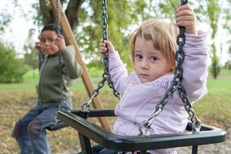 Adoptive Brothers on the Swing Stock Photo - Image of adopted, adoption ...