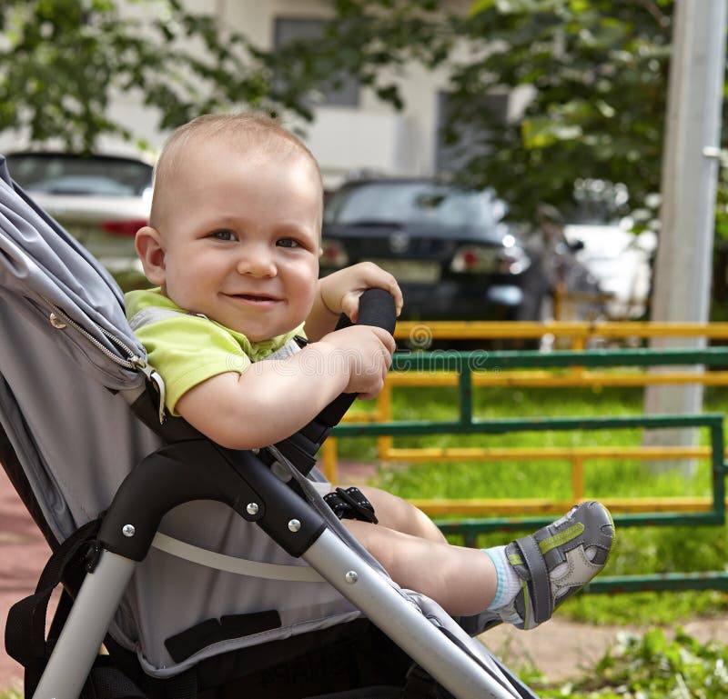 Adorable Baby Boy in a Stoller Stock Photo - Image of human, child ...
