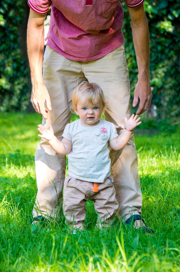 Adorable Baby Girl Making First Steps. Stock Photo - Image of legs ...
