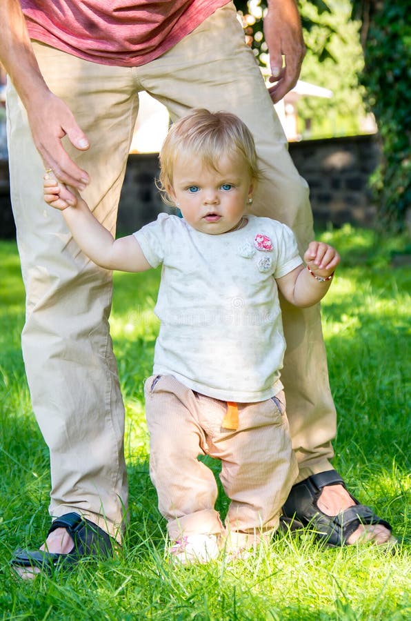 Adorable Baby Girl Making First Steps Stock Photo - Image of girl ...