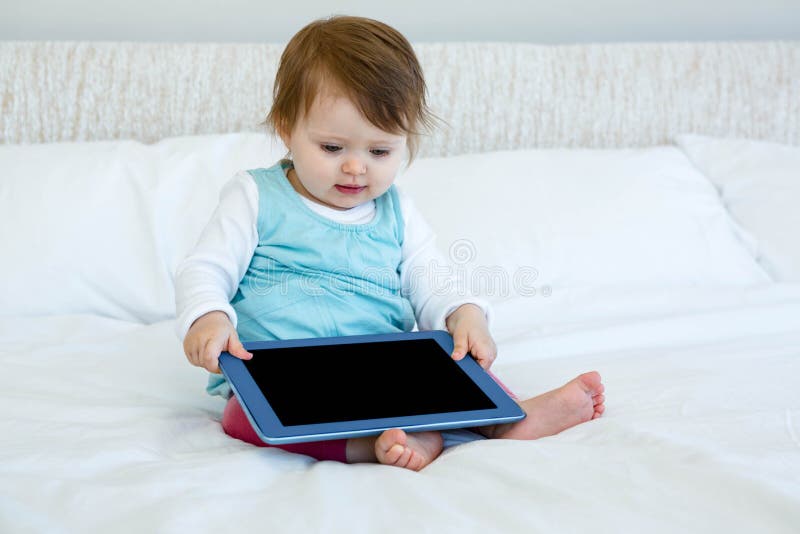 Adorable Baby Holding Aa Tablet Computer Stock Image - Image of amusing ...