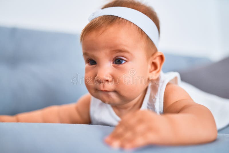 Adorable Baby Lying Down on the Sofa at Home Stock Image - Image of ...