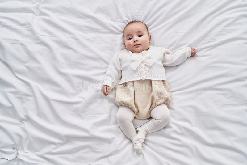 Adorable Baby Relaxed Lying on Bed at Bedroom Stock Image - Image of ...