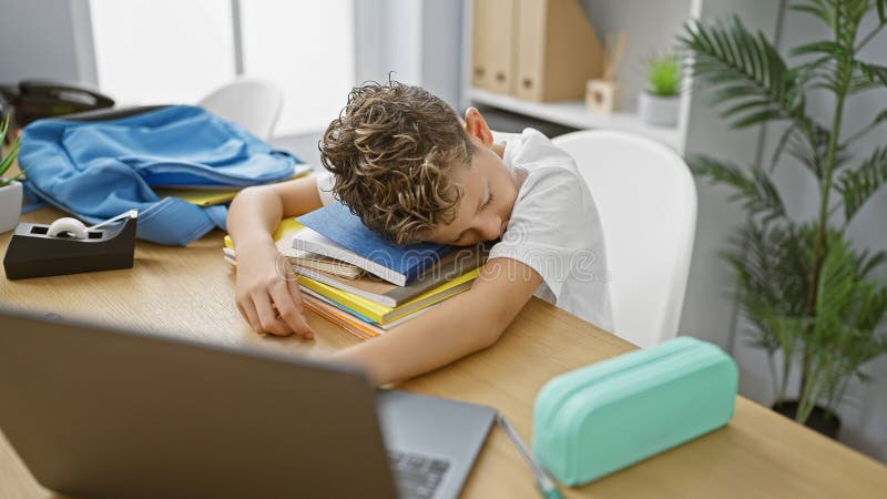 Adorable Blond Boy Student, Tired yet Diligent, Caught Sleeping on His ...