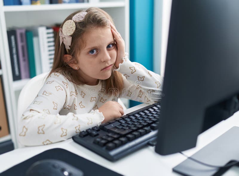Adorable Blonde Girl Student Tired Using Computer at Classroom Stock ...