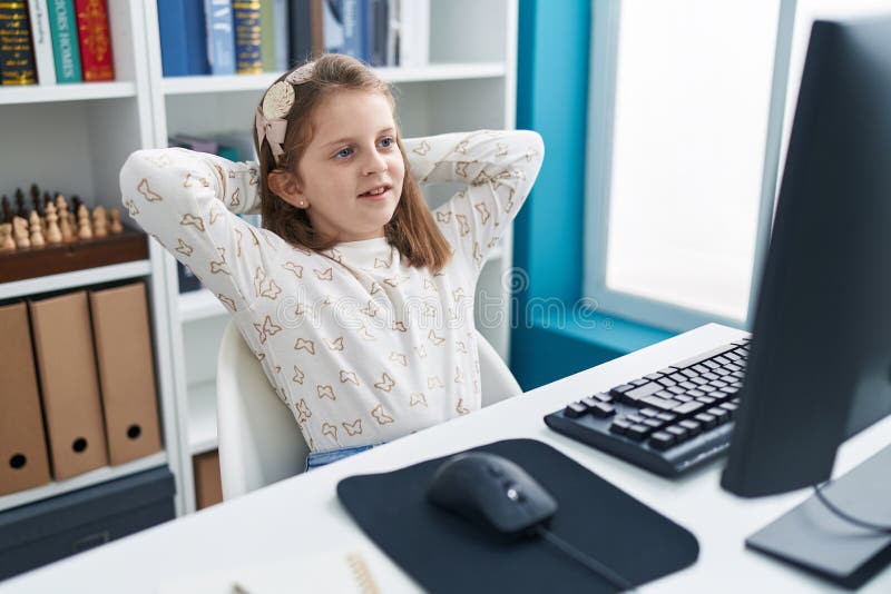 Adorable Blonde Girl Student Using Computer Resting with Hands on Head ...