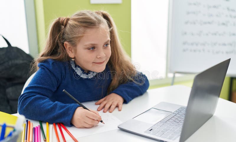 Adorable Blonde Girl Student Using Laptop Writing Notes at Classroom ...