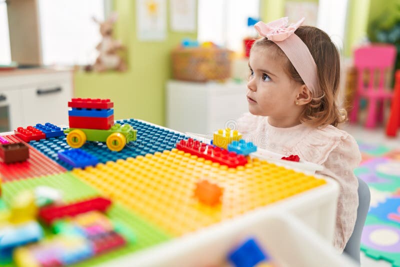 Adorable Blonde Toddler Playing with Construction Blocks Sitting on ...