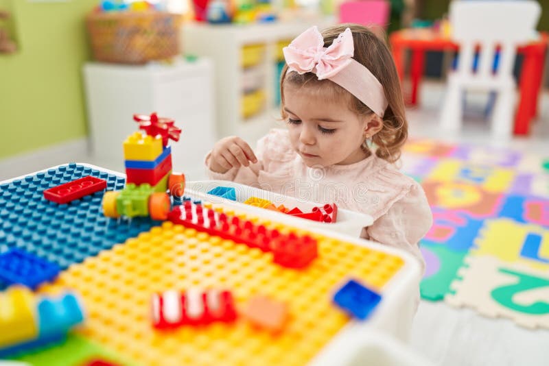 Adorable Blonde Toddler Playing with Construction Blocks Sitting on ...