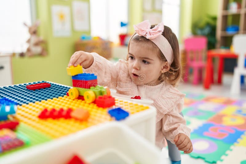 Adorable Blonde Toddler Playing with Construction Blocks Sitting on ...