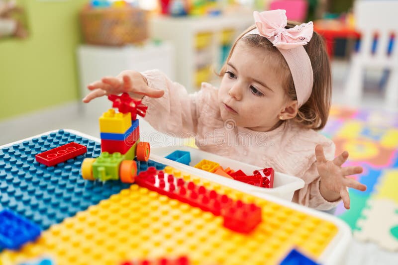Adorable Blonde Toddler Playing with Construction Blocks Sitting on ...