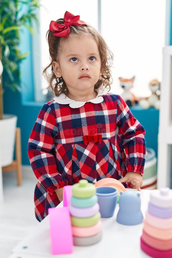 Adorable Blonde Toddler Standing with Serious Expression at ...