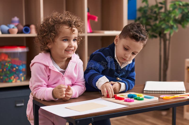 Adorable Boy and Girl Playing with Maths Puzzle Game Sitting on Table ...