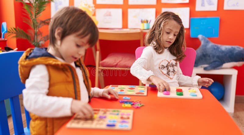 Adorable Boy and Girl Playing with Maths Puzzle Game Sitting on Table ...