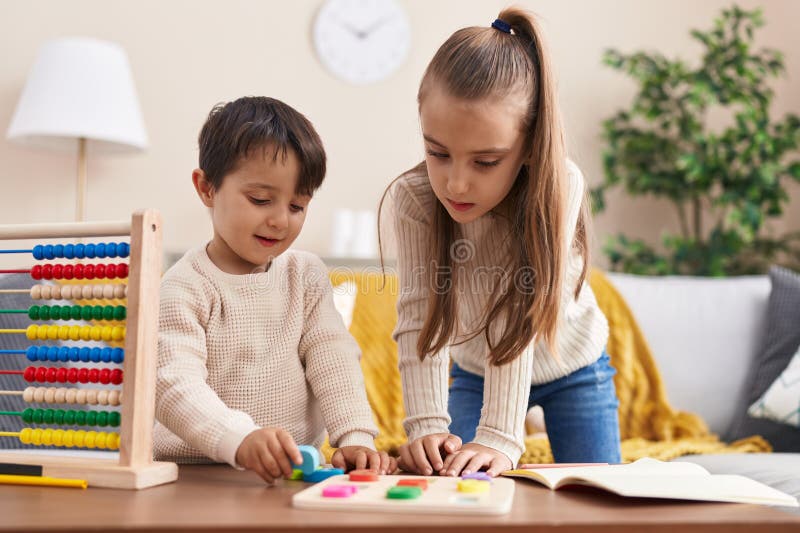 Adorable Boy and Girl Playing with Maths Puzzle Game Standing at Home ...
