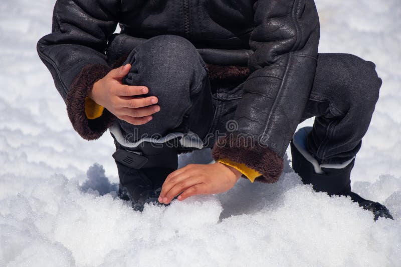 Adorable Boy Hand on Snow Ice in Winter with Leather Clothes Stock ...
