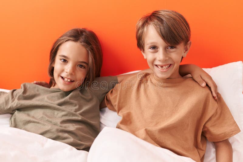 Adorable Boys Hugging Each Other Sitting on Sofa at Bedroom Stock Image ...