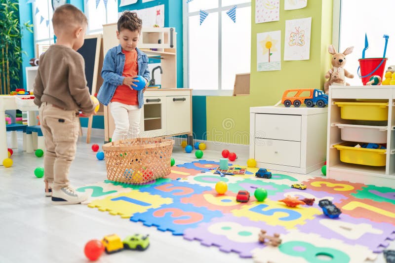 Adorable Boys Playing with Balls Standing at Kindergarten Stock Image ...