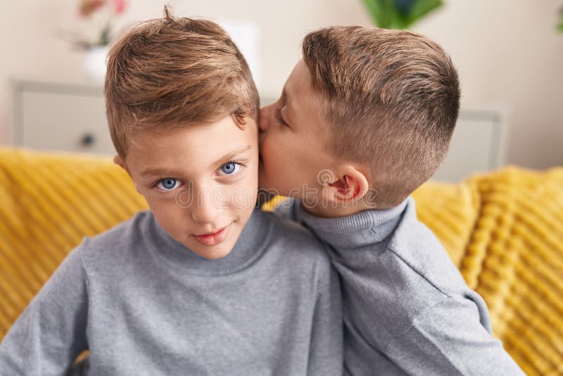 Adorable Boys Sitting on Sofa Kissing at Home Stock Photo - Image of ...