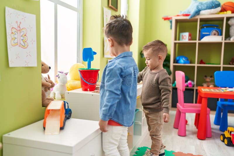 Adorable Boys Standing with Relaxed Expression Playing at Kindergarten ...