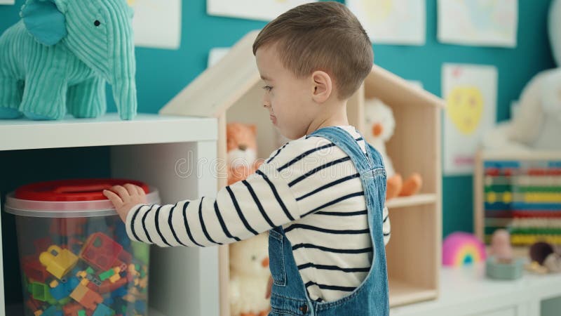 Adorable Caucasian Boy Holing Cube with Construction Blocks at ...
