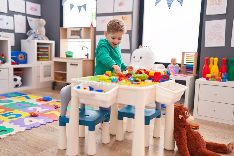 Adorable Caucasian Boy Playing with Construction Blocks Standing at ...
