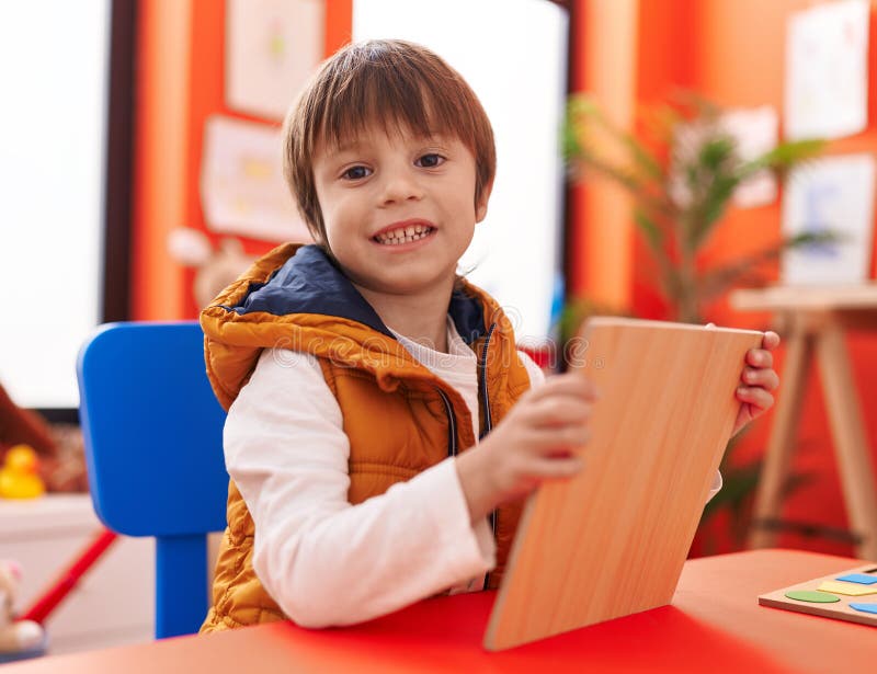 Adorable Caucasian Boy Smiling Confident Sitting on Table at ...