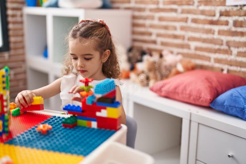 Adorable Caucasian Girl Playing with Construction Blocks Sitting on ...