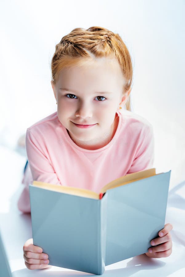 Adorable Child Holding Book and Smiling Stock Photo - Image of ...