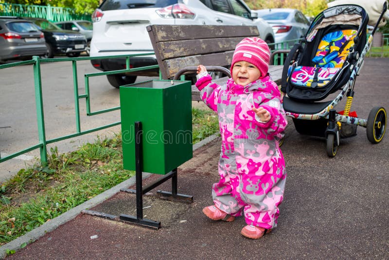 Adorable Toddler is Throwing Garbage in the Trash Stock Photo - Image ...