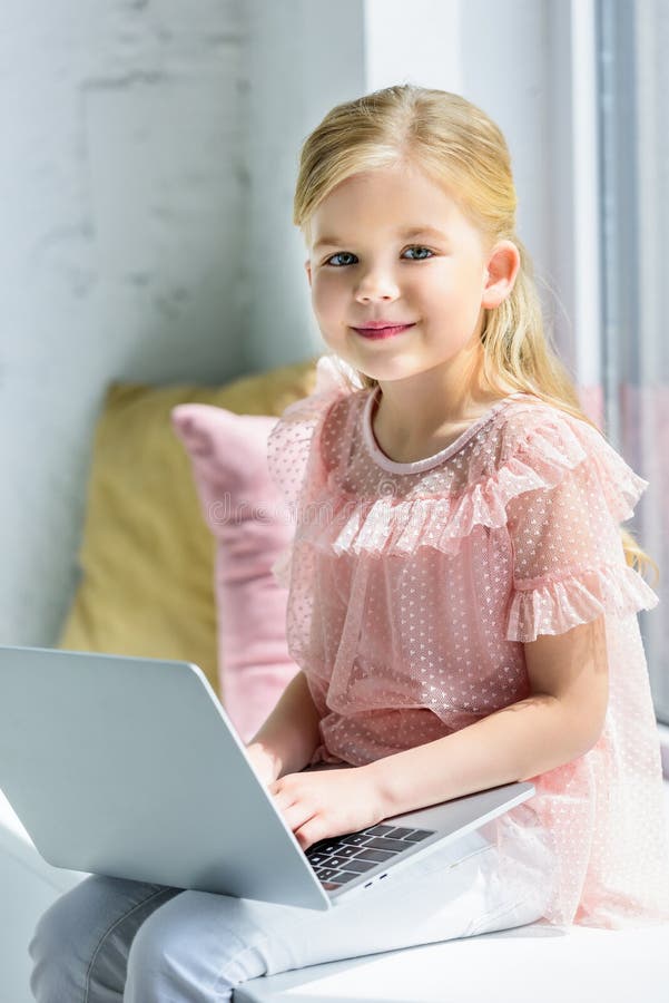 Adorable Child Using Laptop and Smiling at Camera Stock Photo - Image ...