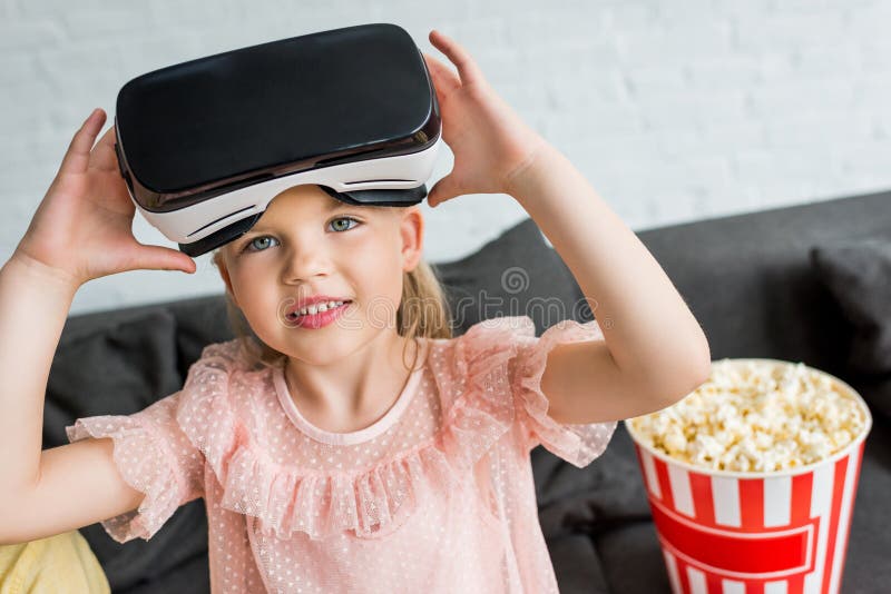Adorable Child in Virtual Reality Headset Smiling at Camera Stock Photo ...