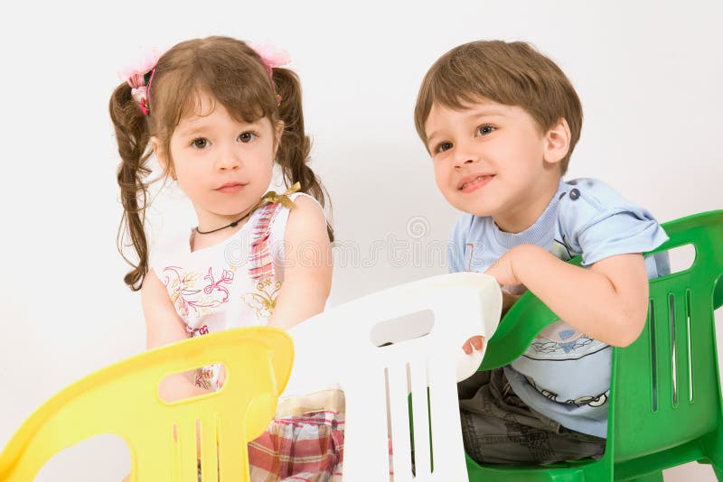 Adorable Children Sitting on Colorful Chairs Stock Image - Image of ...