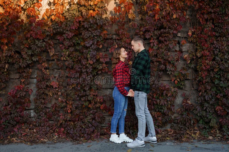 Adorable Couple Sharing a Tender Moment Against a Fall Foliage ...