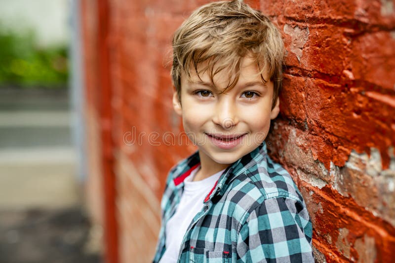 Adorable Cute Boy Staing Near a Red Brick Wall Stock Photo - Image of ...
