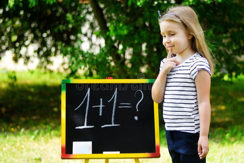 Adorable Funny Little Girl at Blackboard Practicing Counting and Math ...