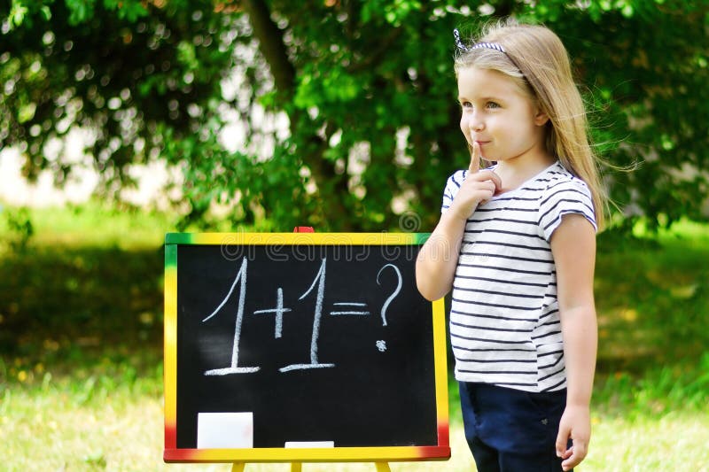 Adorable Funny Little Girl at Blackboard Practicing Counting and Math ...
