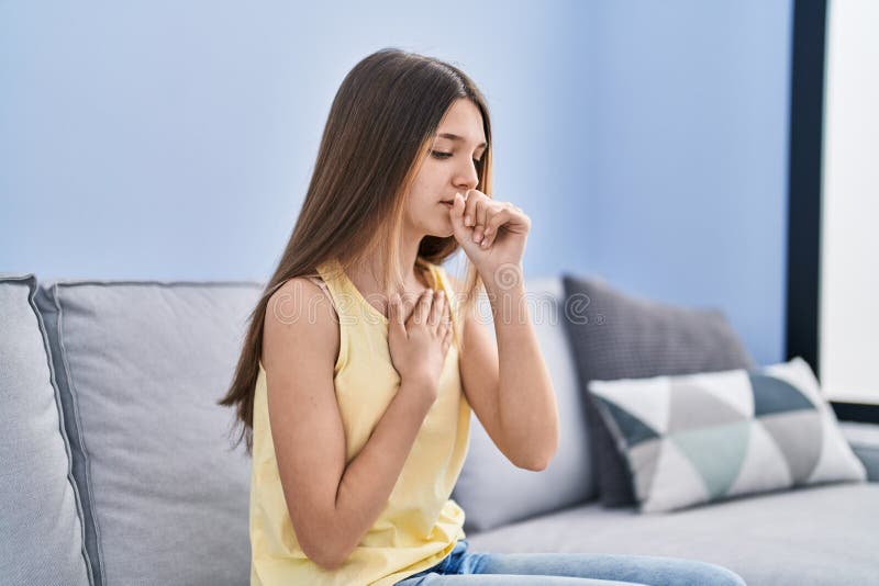 Adorable Girl Coughing Sitting on Sofa at Home Stock Photo - Image of ...