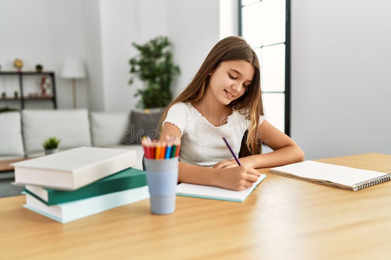 Adorable Girl Doing Homework Sitting on Table at Home Stock Image ...