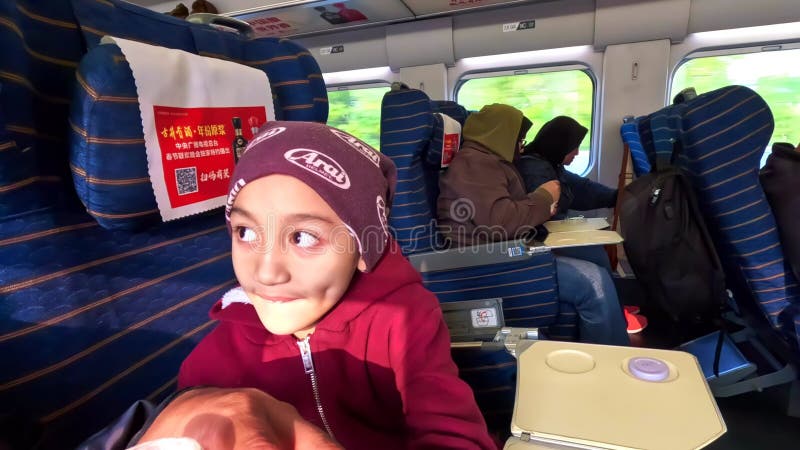 The Adorable Girl is Drinking Inside the Moving Bullet Train. Stock ...