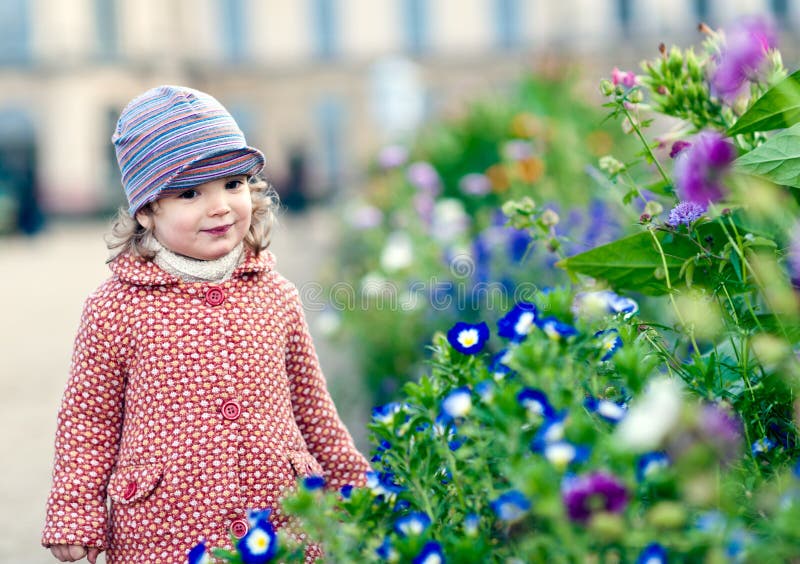 Adorable girl with flowers stock photo. Image of girl - 22231354